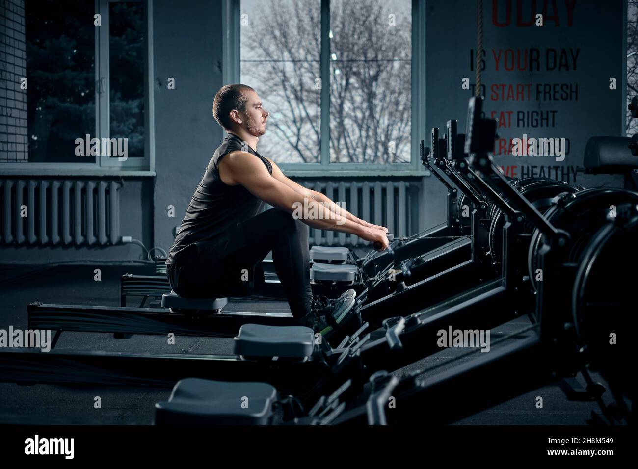 Male bodybuilder flexing muscles side hi-res stock photography and ...