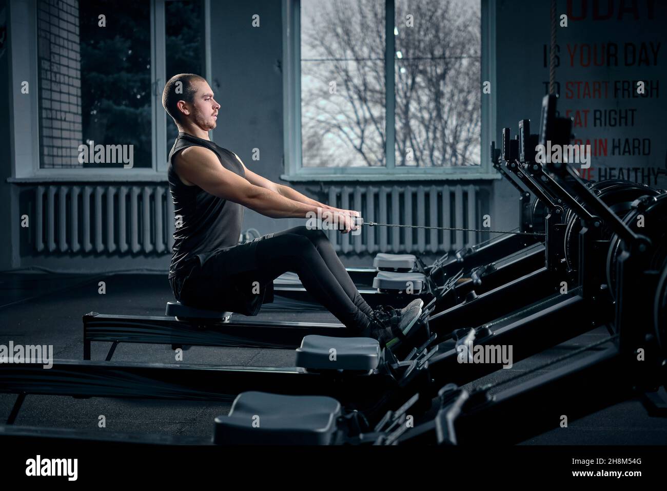 Male bodybuilder flexing muscles side hi-res stock photography and ...