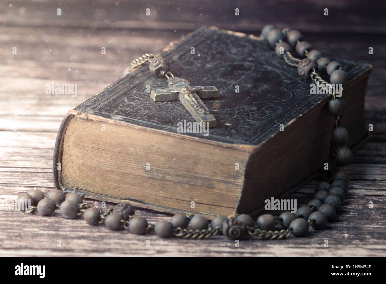 Detail studio shot of very old, vintage Holy Bible with lots of ...