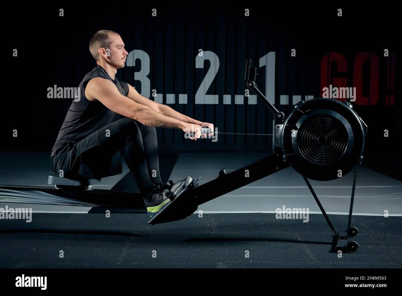 Male bodybuilder flexing muscles side hi-res stock photography and ...