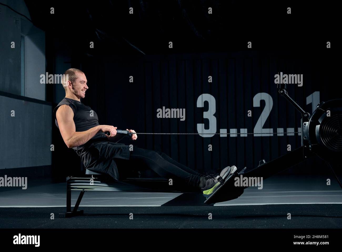 Male bodybuilder flexing muscles side hi-res stock photography and ...