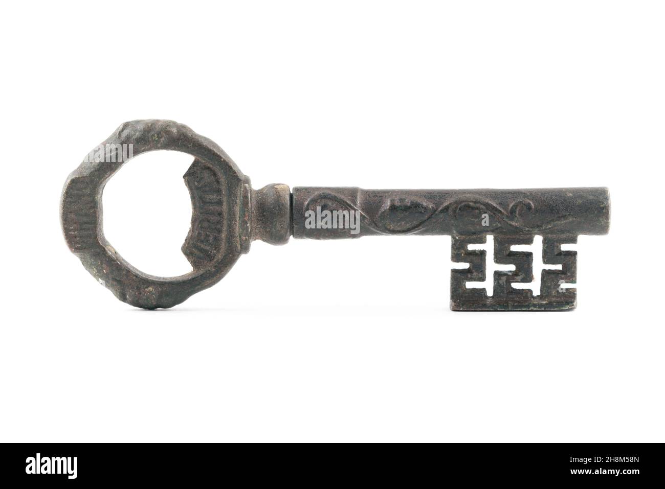 Wide high angle studio shot of very old metal vintage decorative key ...