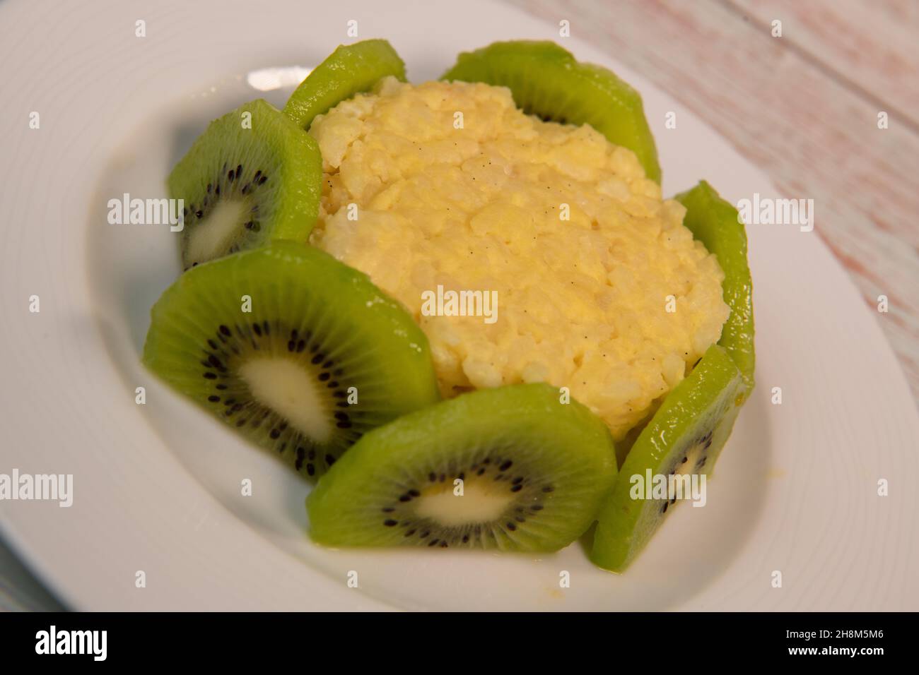 Baby eating rice pudding hi-res stock photography and images - Alamy