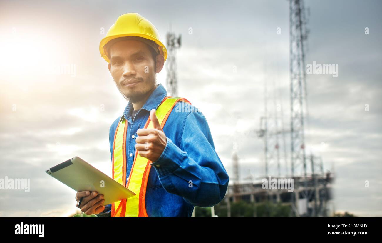 Engineer holding tablet working technology professional Stock Photo - Alamy