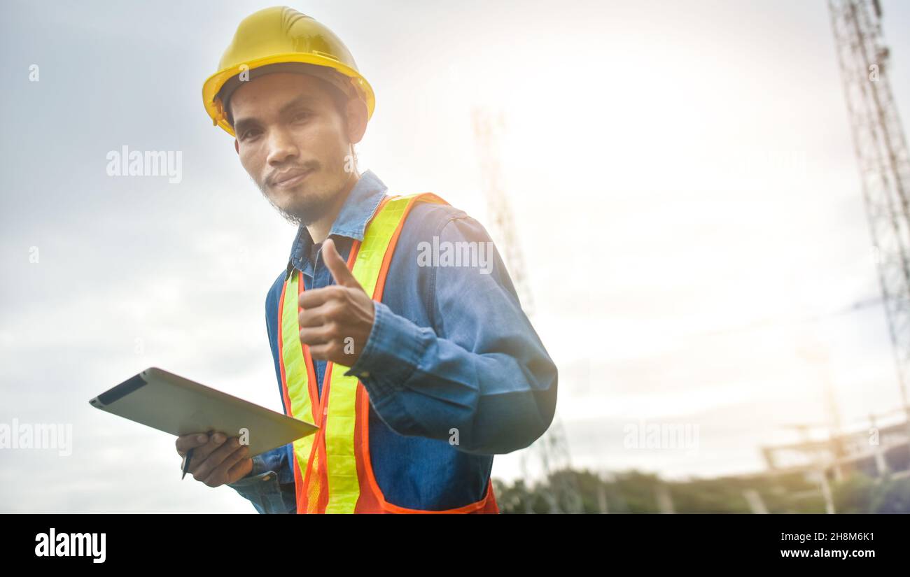 Engineer holding tablet working technology professional Stock Photo - Alamy