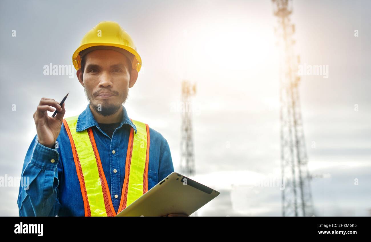 Engineer holding tablet working technology professional Stock Photo - Alamy