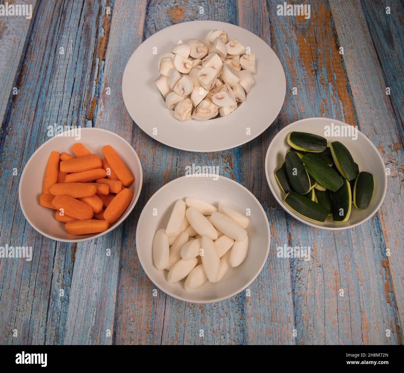 Turned, peeled, chopped vegetables, carrot, turnip, zucchini, mushroom ...