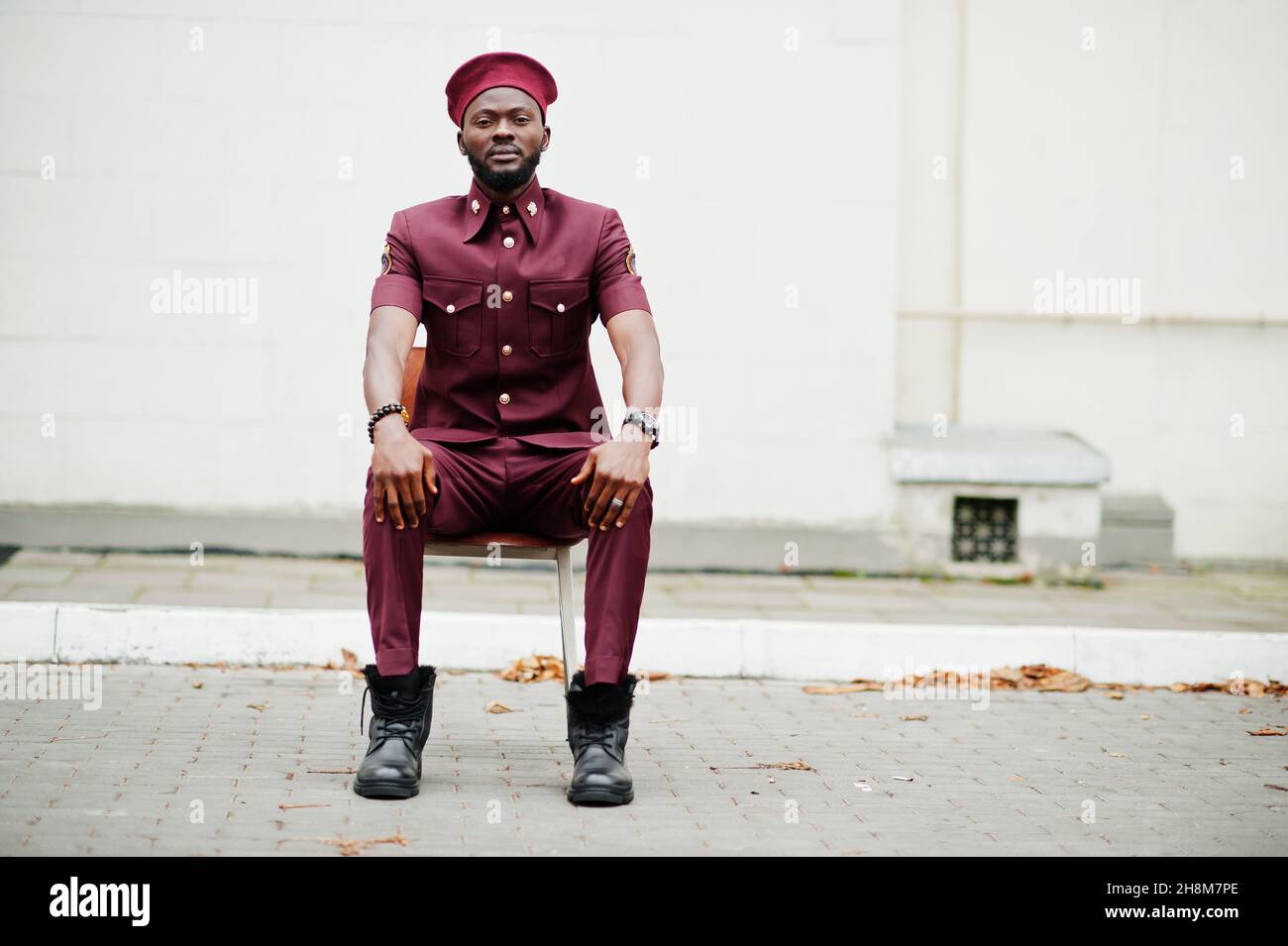 Portrait of African American military man in red uniform and beret ...