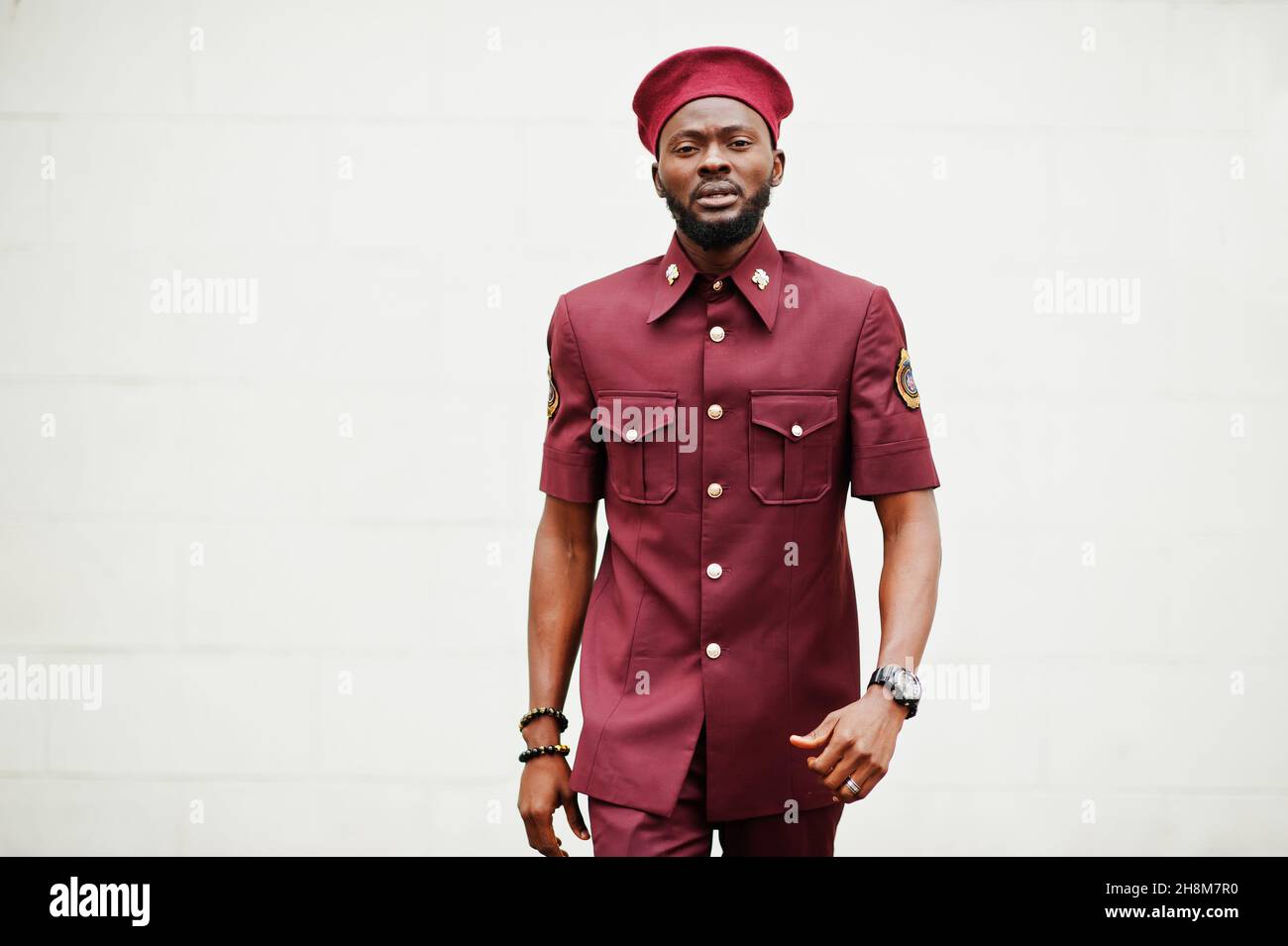 Portrait of African American military man in red uniform and beret ...