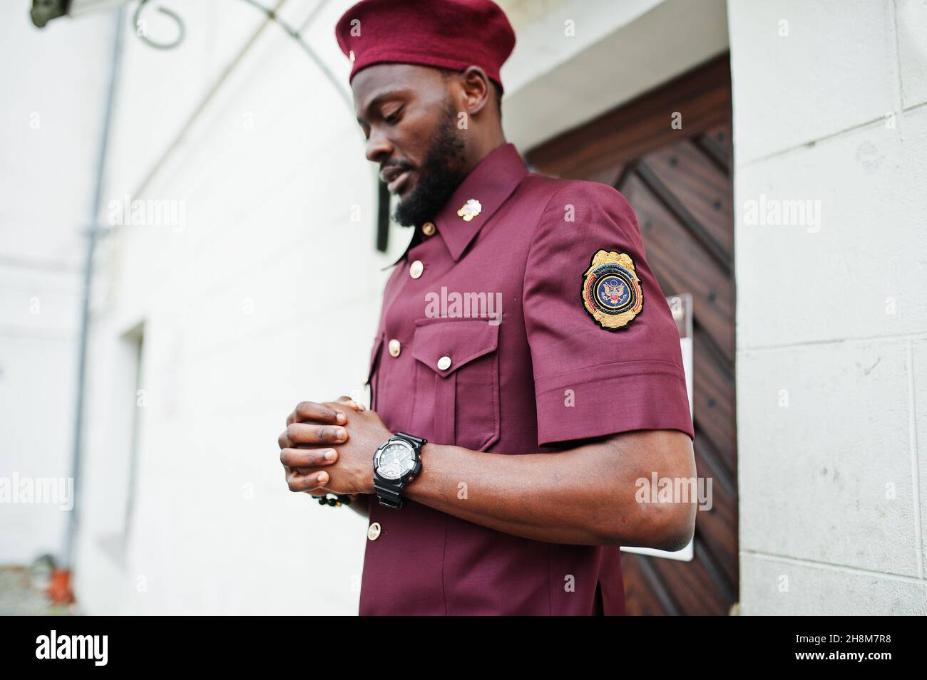 Portrait of African American military man in red uniform and beret ...