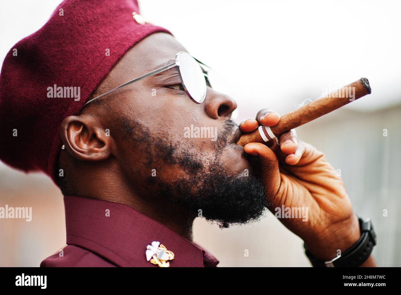 Portrait of African American military man in red uniform, sungalasses ...