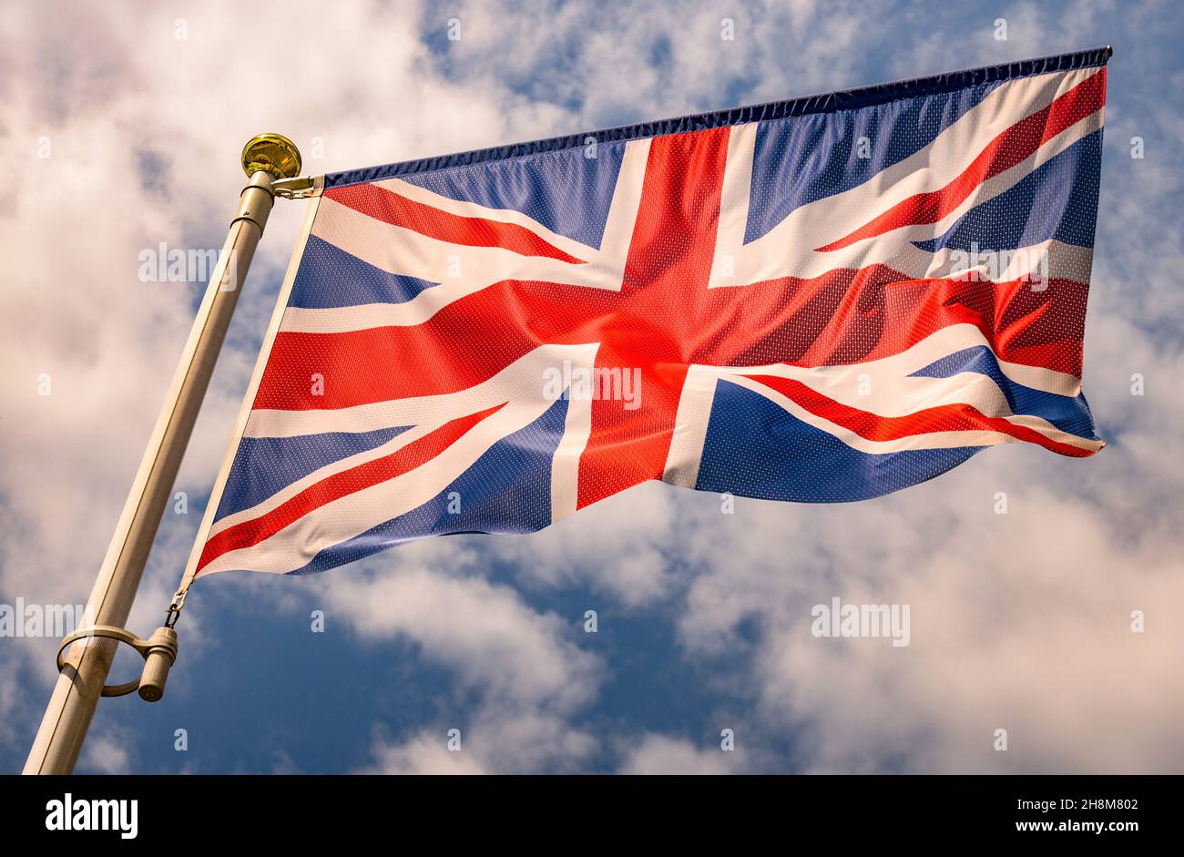 union jack flag on blue sky Stock Photo - Alamy