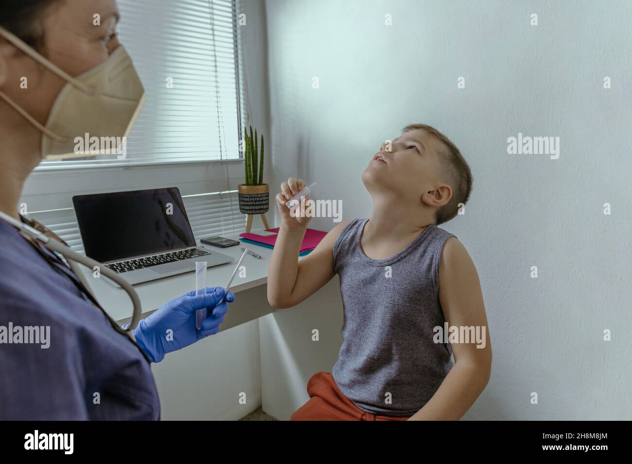 Child Having Saline Gargle PCR Test Performed at Doctor Office. Female ...