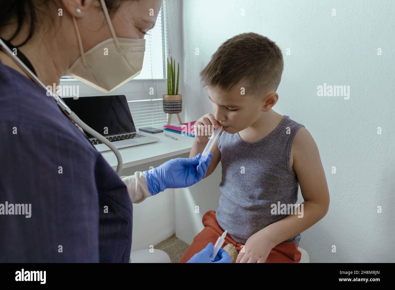Child Having Saline Gargle PCR Test Performed at Doctor Office. Female ...