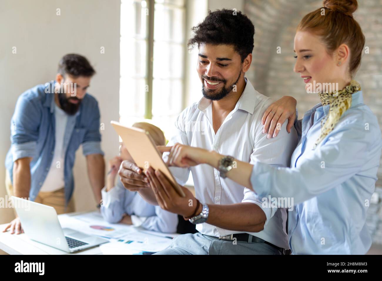 Group of multiethnic business people cooperating during business ...