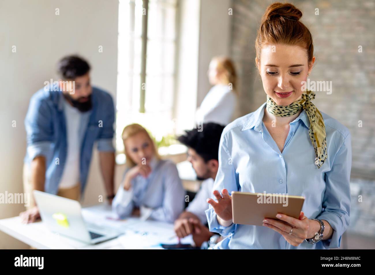 Portrait of business people having fun, working together and chatting ...
