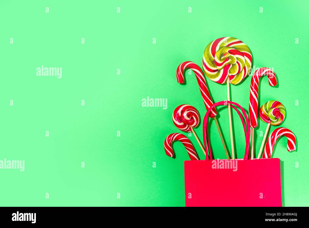 Christmas Festive Background with candy cane sweets on high-colored ...
