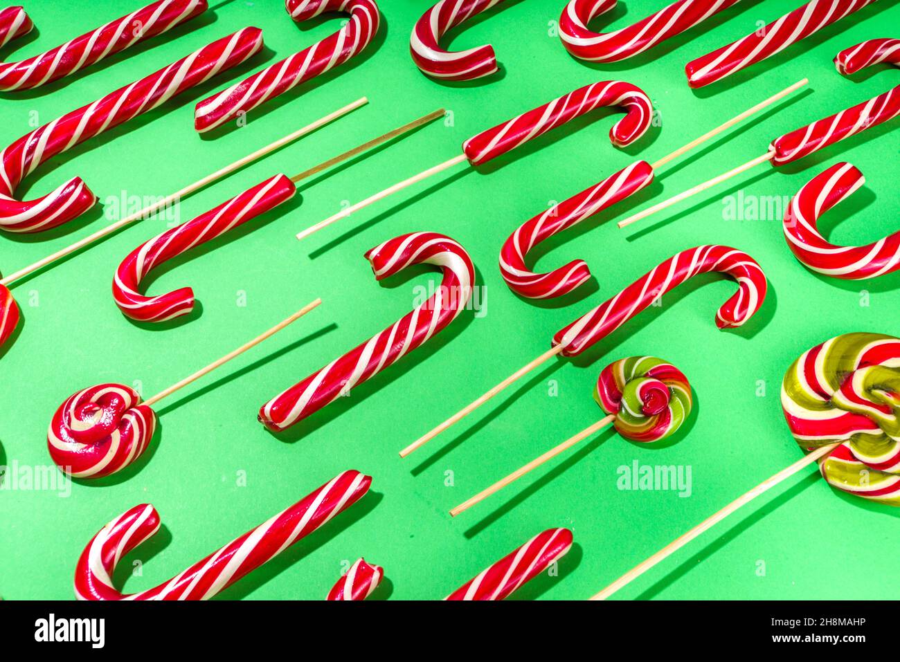 Christmas Festive Background with candy cane sweets on high-colored ...