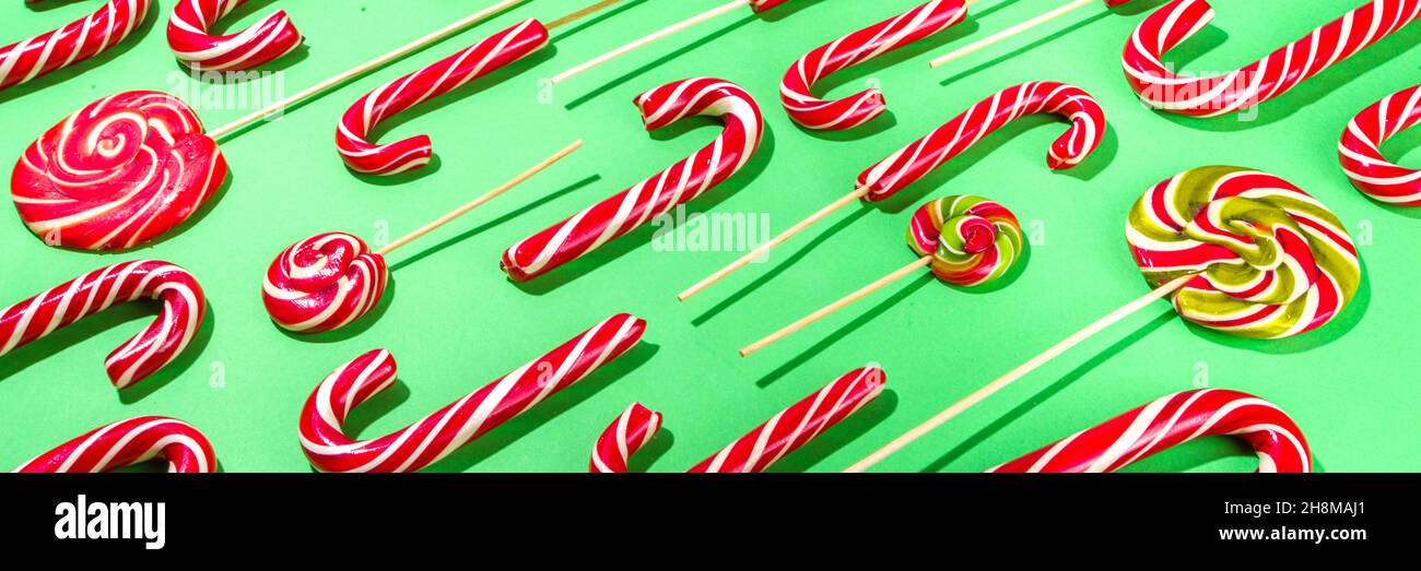 Christmas Festive Background with candy cane sweets on high-colored ...