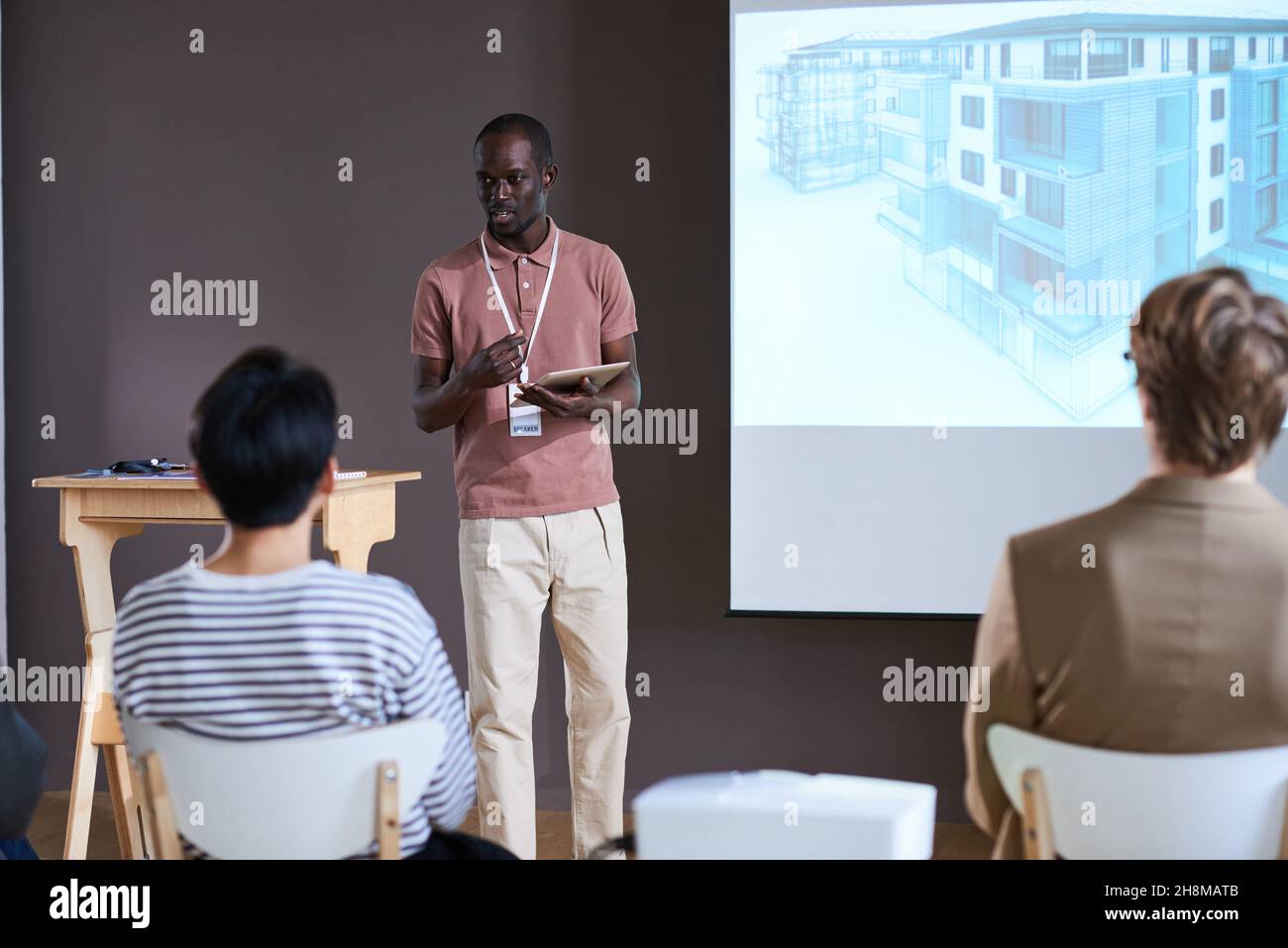 African young businessman using digital tablet presenting his project ...