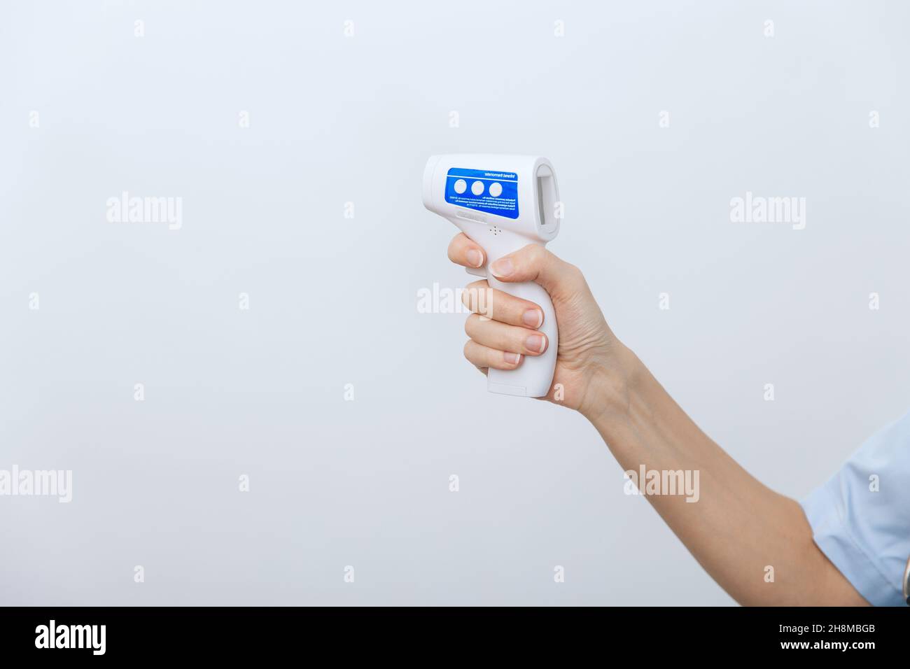 Temperature measurement gun in doctor hands. Close-up shot of doctor ...