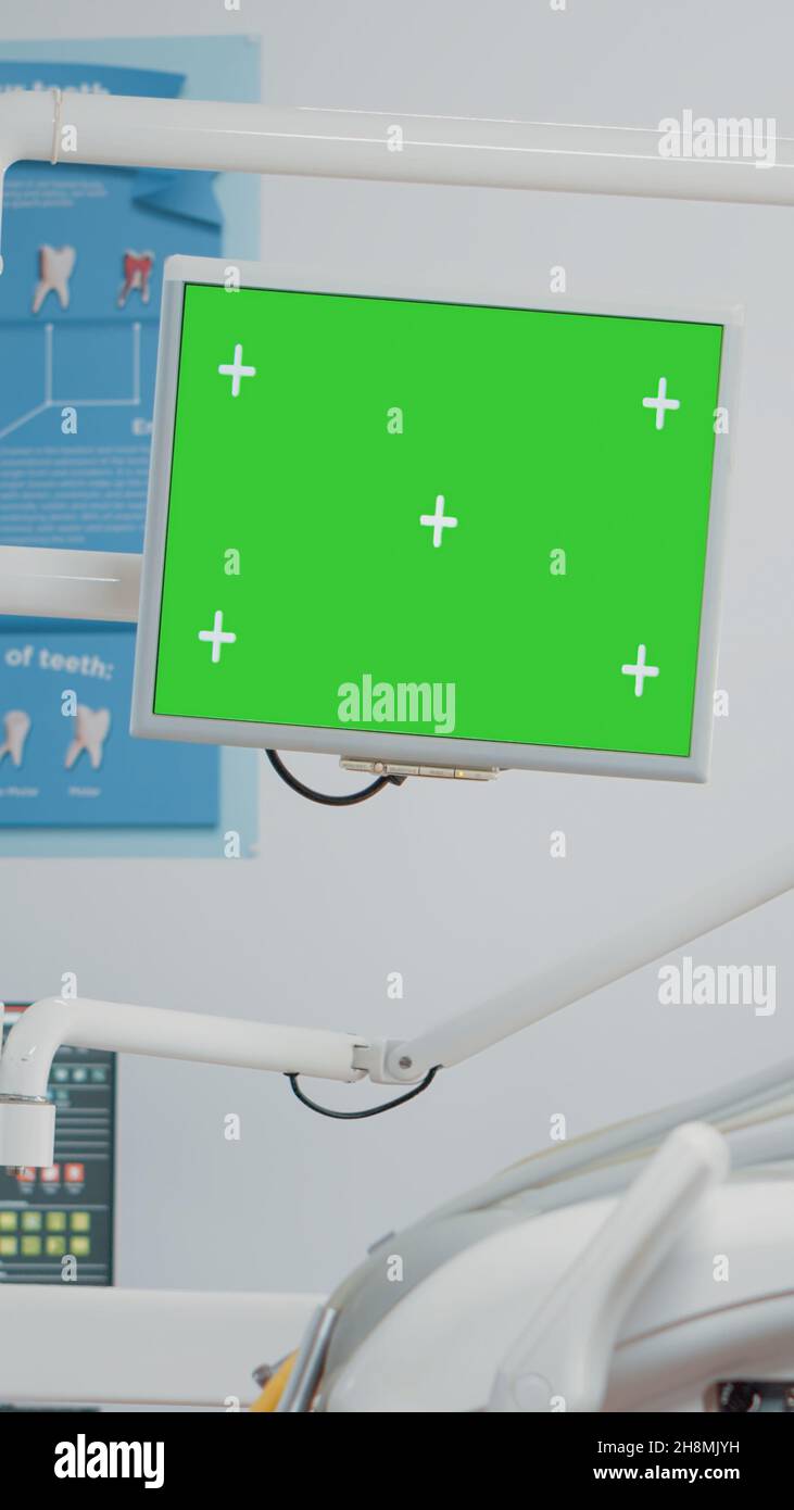 Dental team working with green screen on computer in cabinet for oral ...