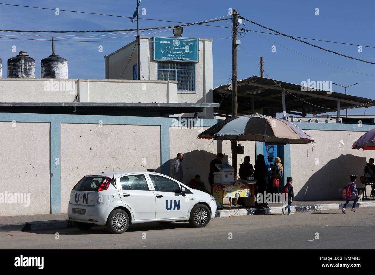 Palestinians receiving food aid for the new cycle from a UN (UNRWA ...