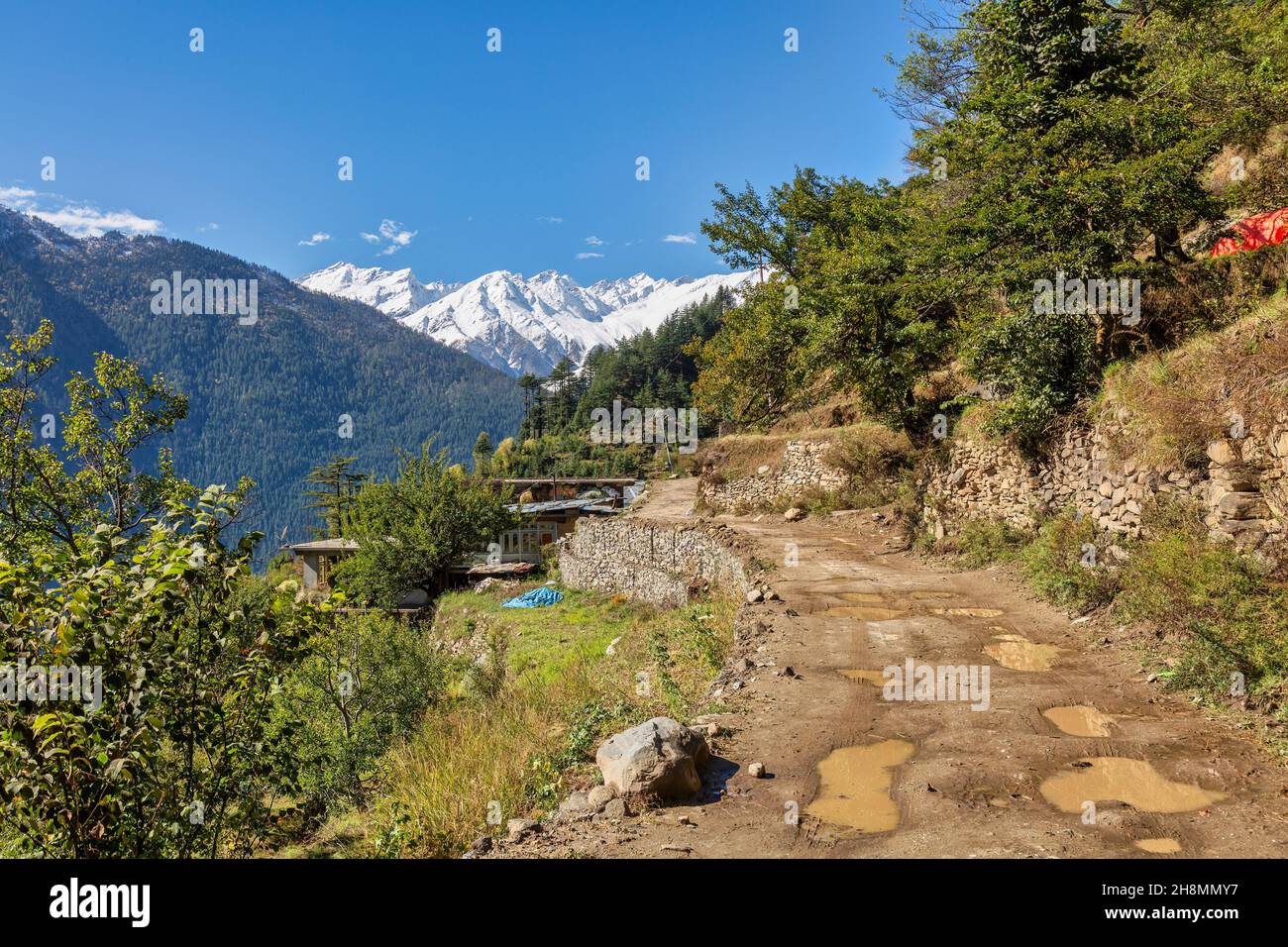 Scenic mountain landscape with unpaved village road with Kinnaur ...