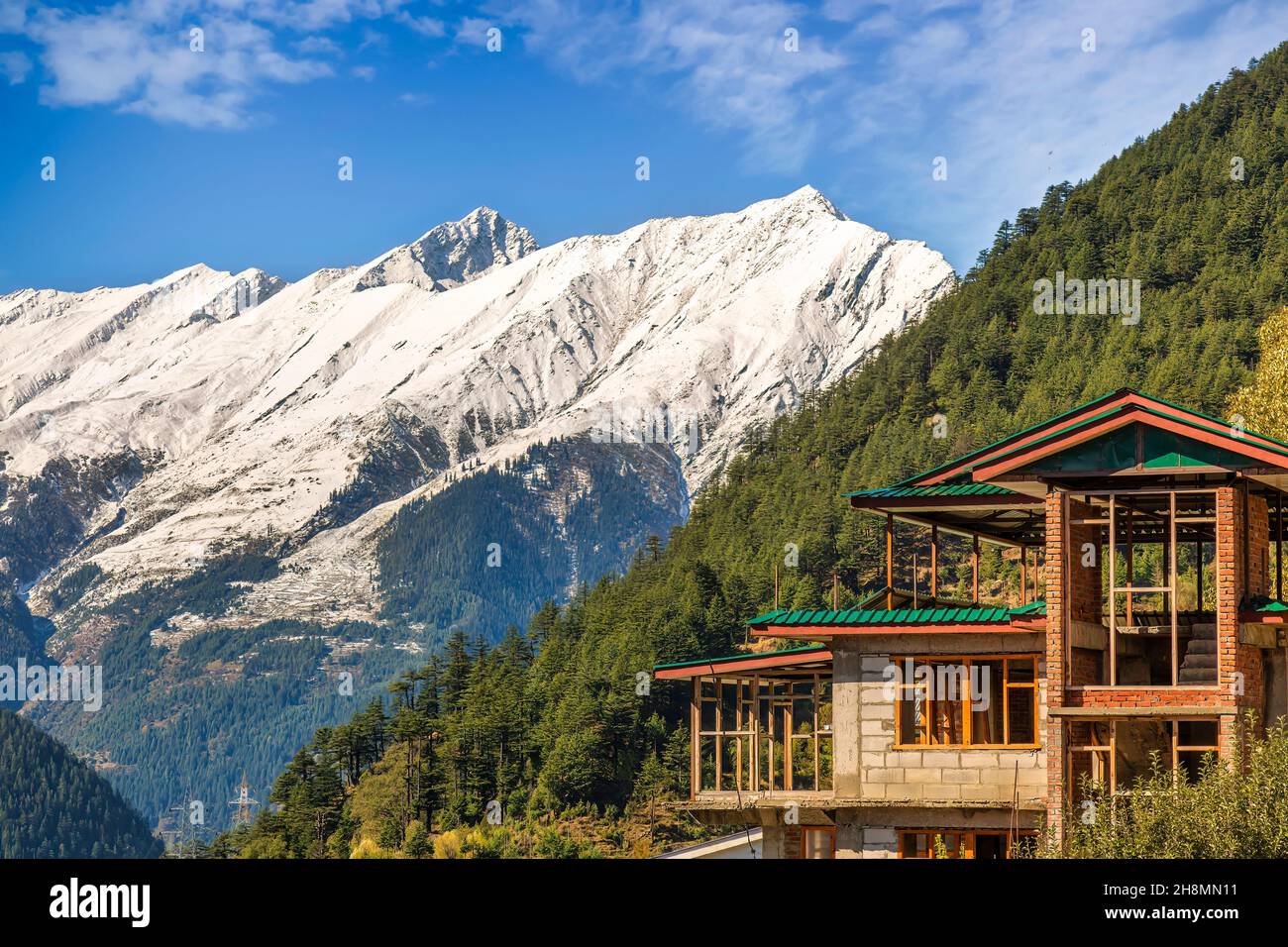 Village house on the mountain slopes with scenic Himalaya landscape at ...