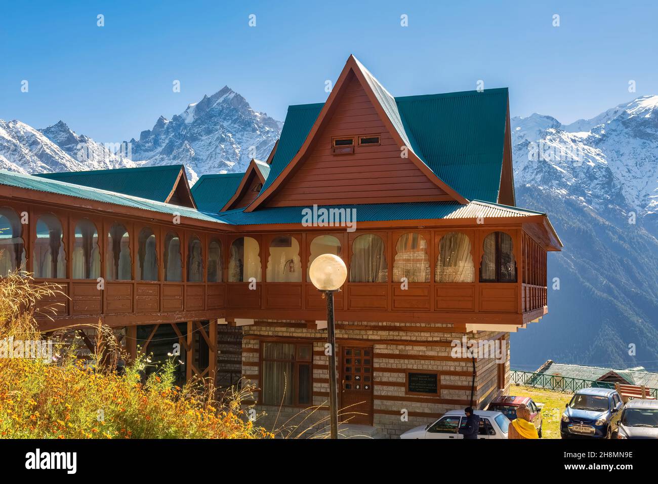 Wooden tourist lodge with view of majestic Kinnaur Kailash Himalaya ...