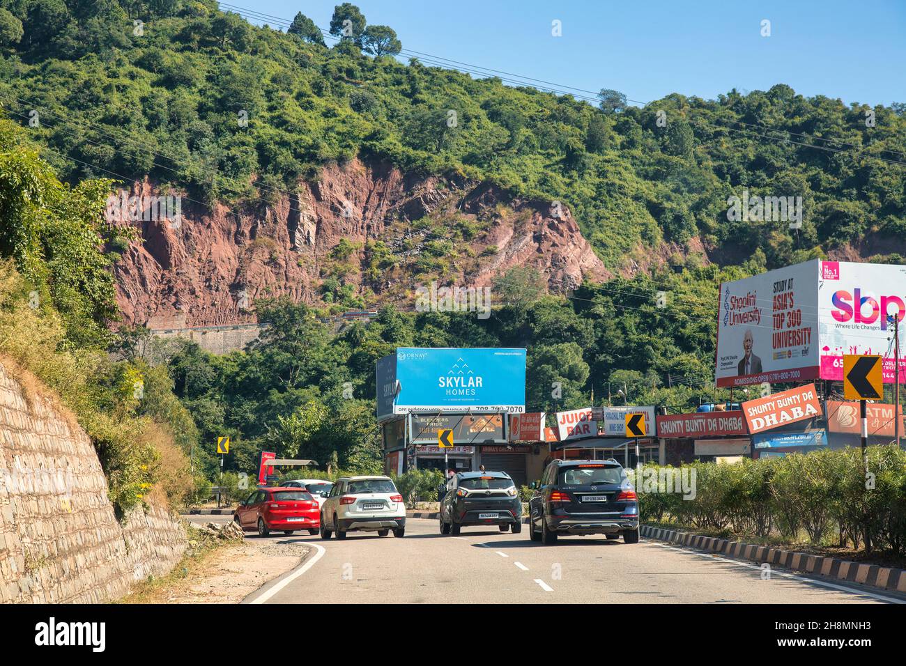 Tourist vehicles on Shimla Kinnaur highway road with scenic Himalaya ...