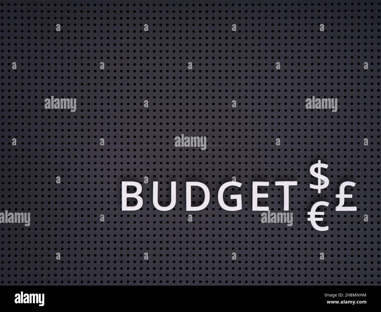 Word Budget with dollar, euro and pound sterling symbols spelled out ...