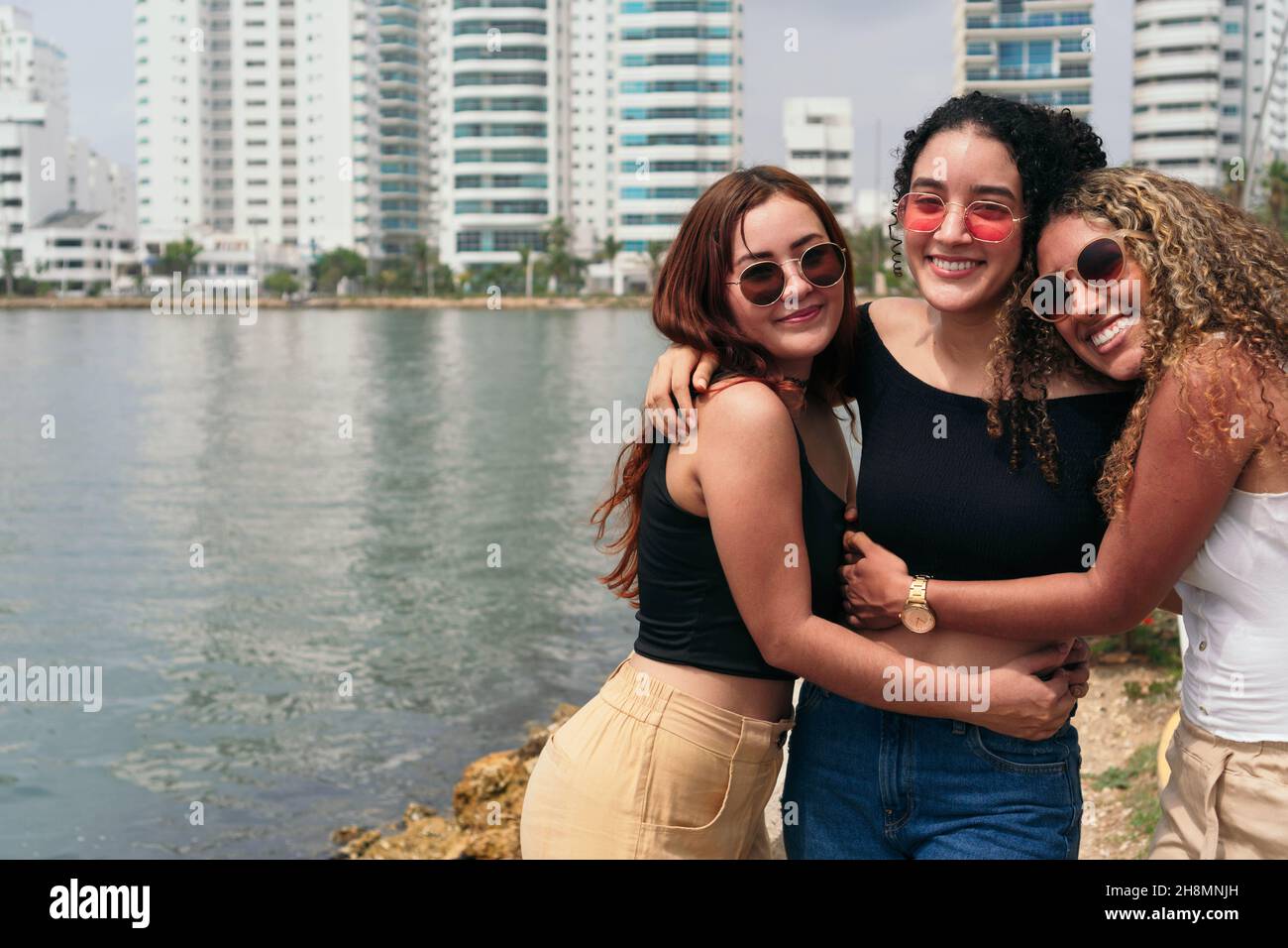 Three crazy friends having fun outdoors Stock Photo - Alamy