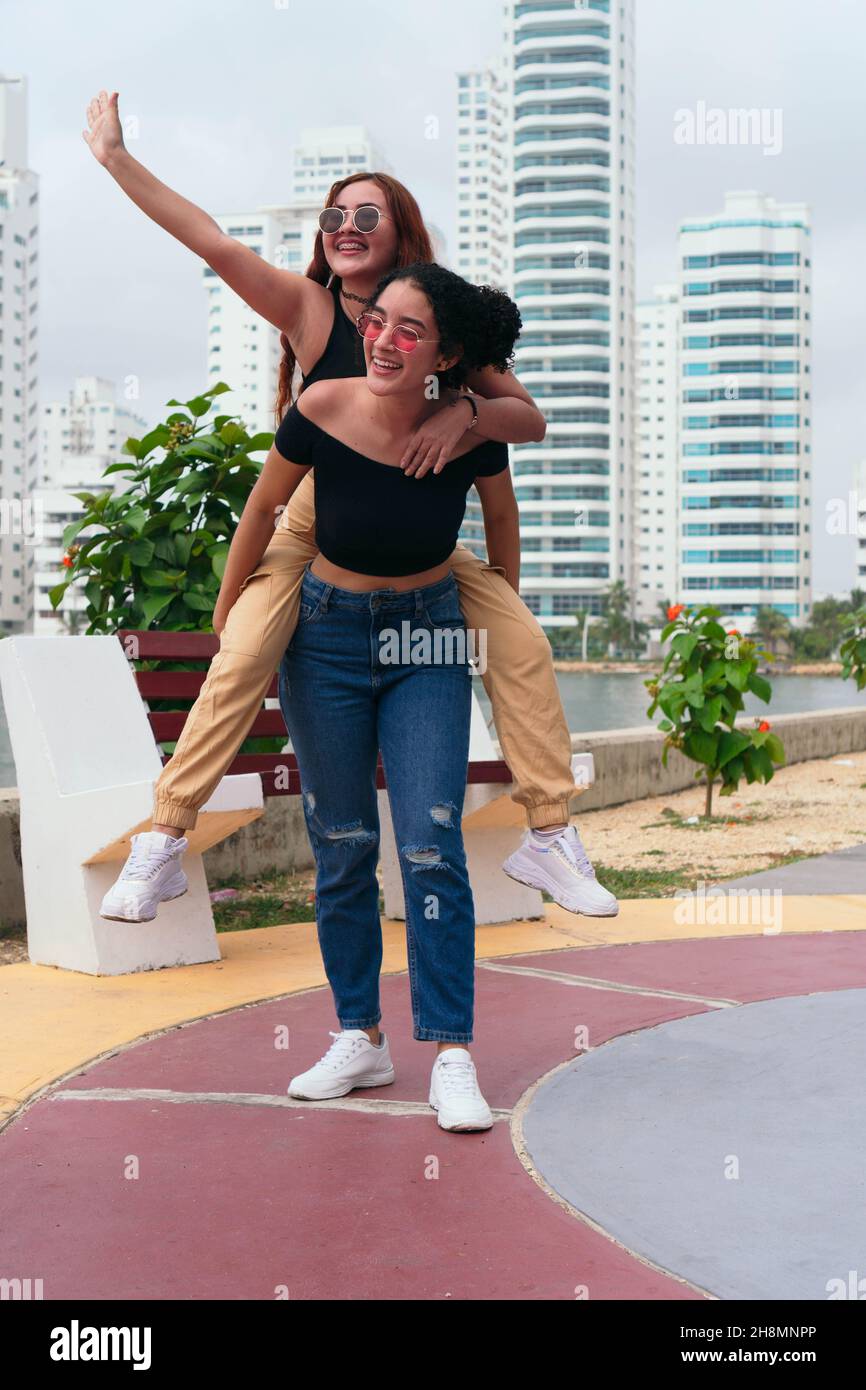 Two friends having fun outdoors Stock Photo - Alamy
