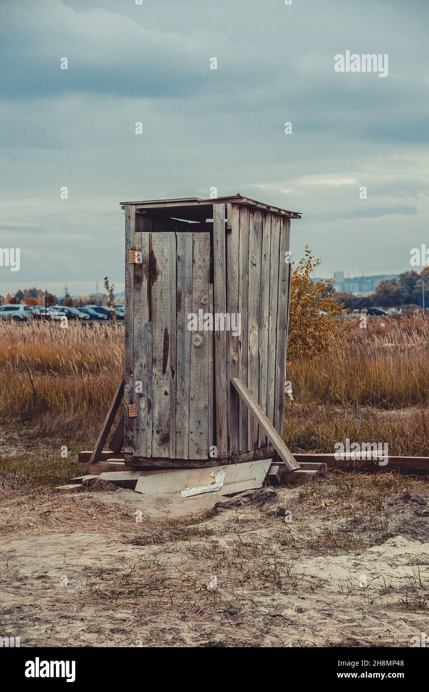 Abandoned wooden outhouse Stock Photo - Alamy