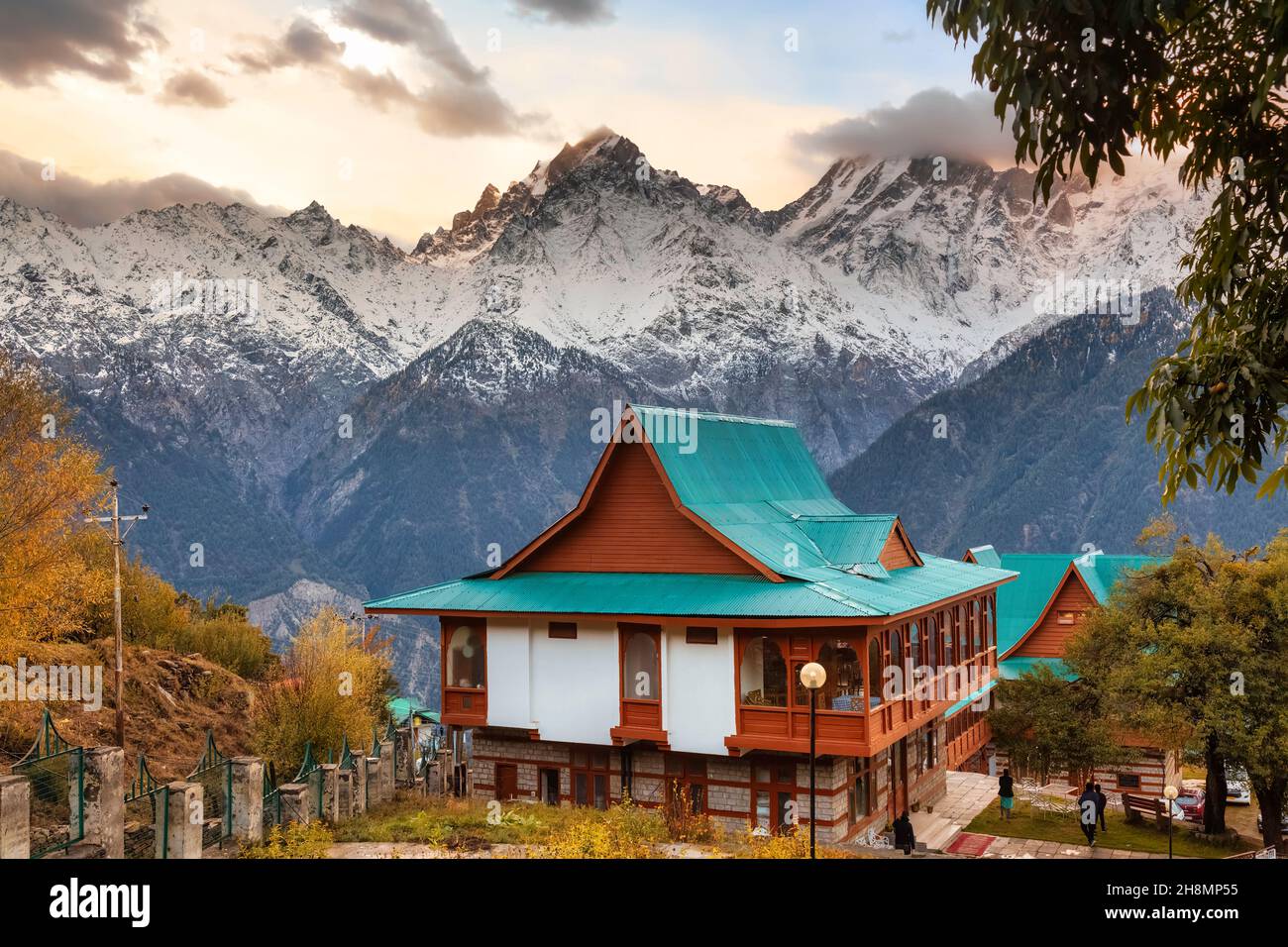 Wooden tourist lodge with view of majestic Kinnaur Kailash Himalaya ...