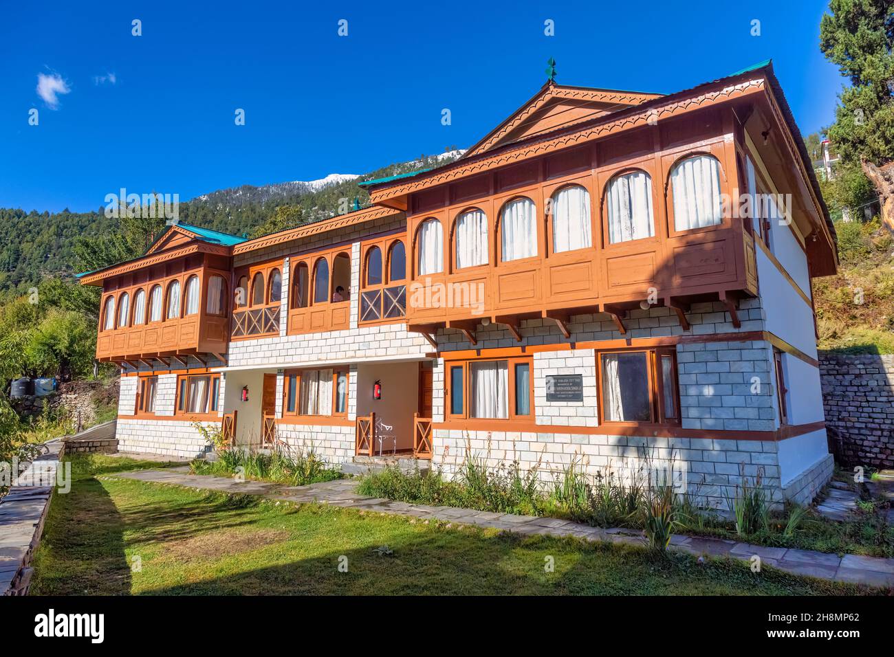 Wooden tourist lodge with view of majestic Kinnaur Kailash Himalaya ...