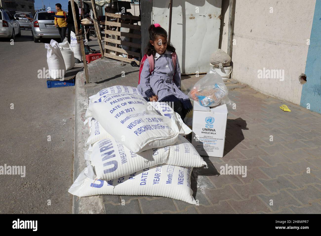 Palestinians receiving food aid for the new cycle from a UN (UNRWA ...