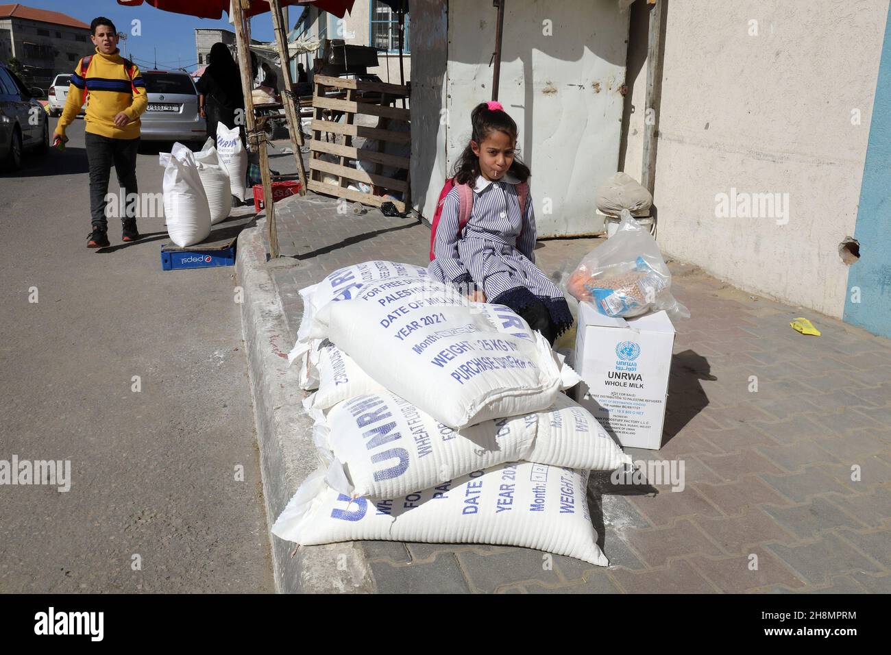 Palestinians receiving food aid for the new cycle from a UN (UNRWA ...