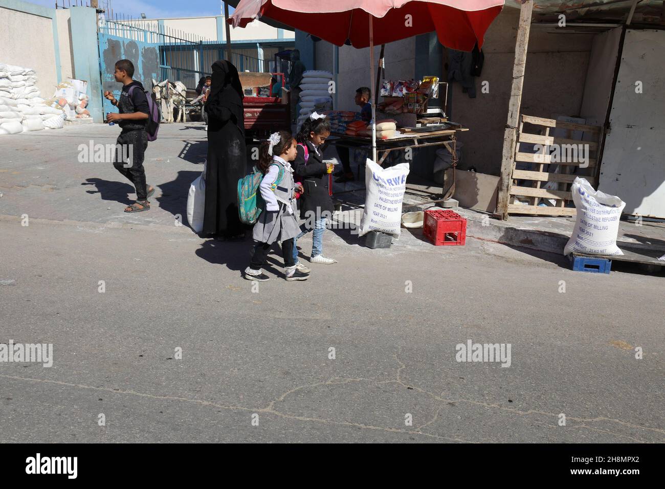 Palestinians receiving food aid for the new cycle from a UN (UNRWA ...