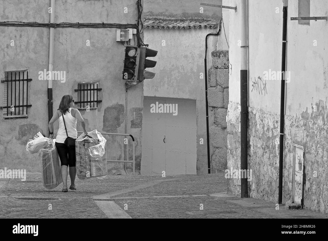 Woman carrying objects Black and White Stock Photos & Images - Alamy