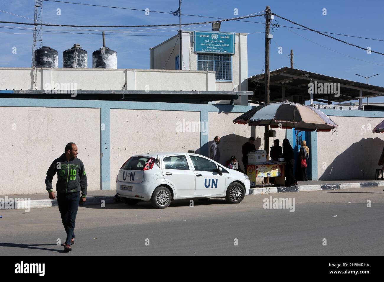 Palestinians receiving food aid for the new cycle from a UN (UNRWA ...