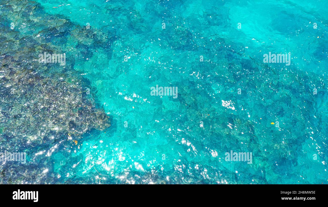 Beautiful rocks in turquoise water. waves rolled on shore stone, broken ...