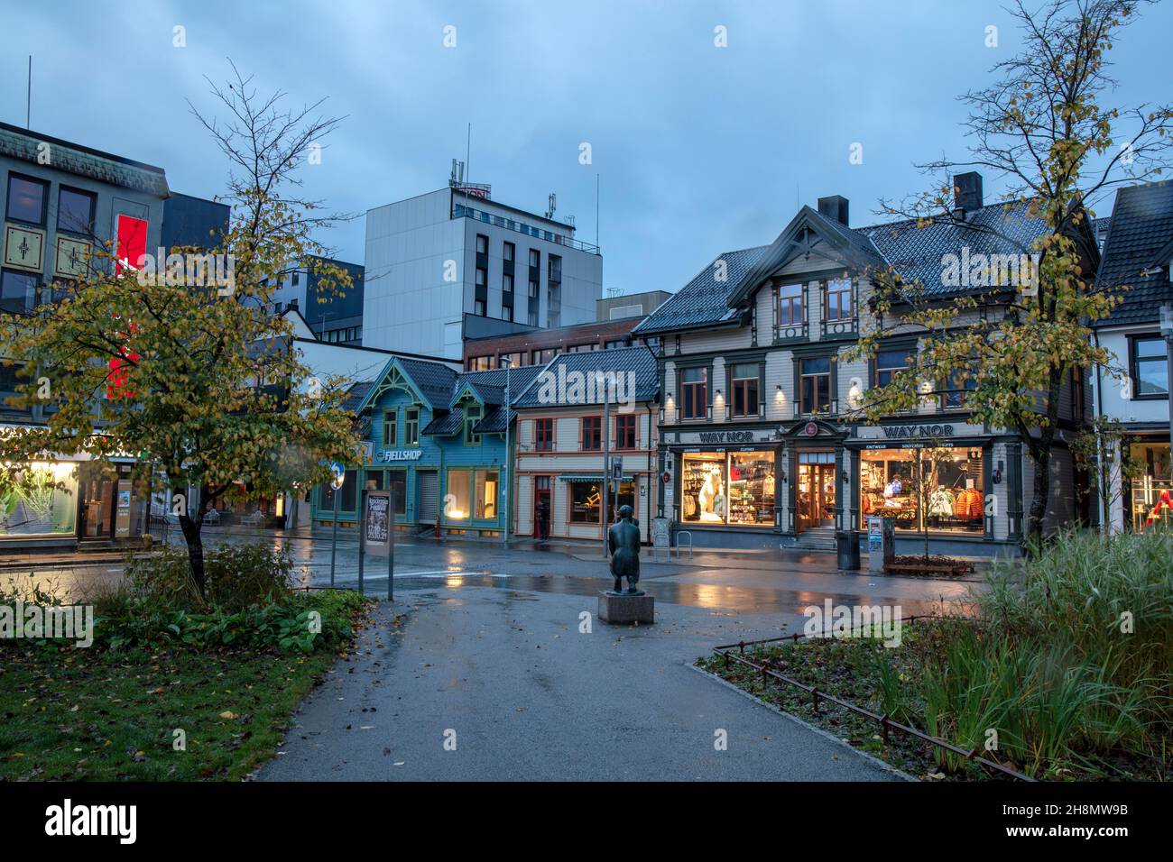 Downtown with small shops in the morning during rainy weather, Tromso ...