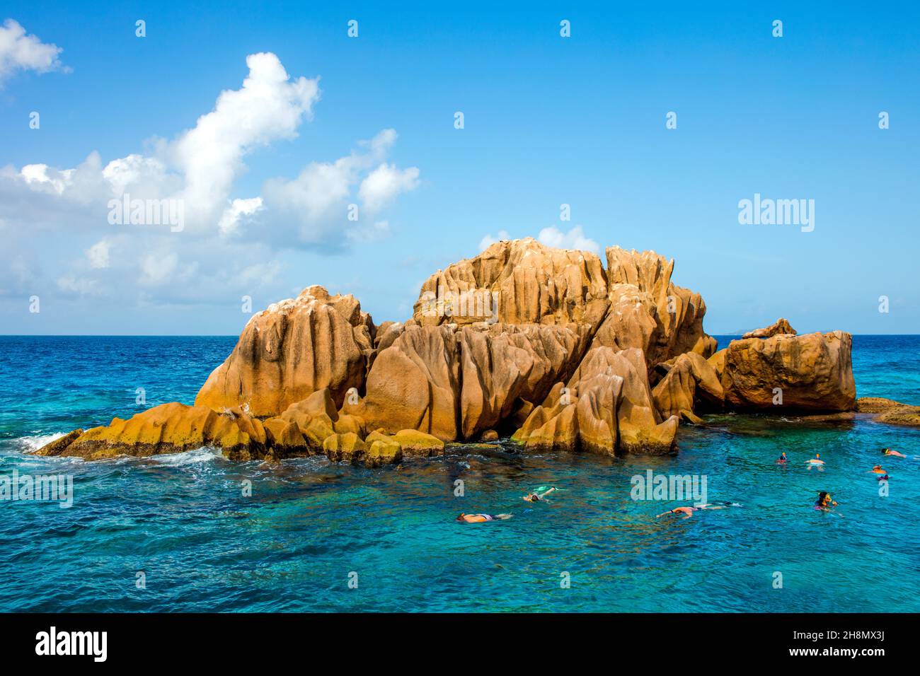 Snorkelling paradise, Seychelles island, turquoise green sea towering ...
