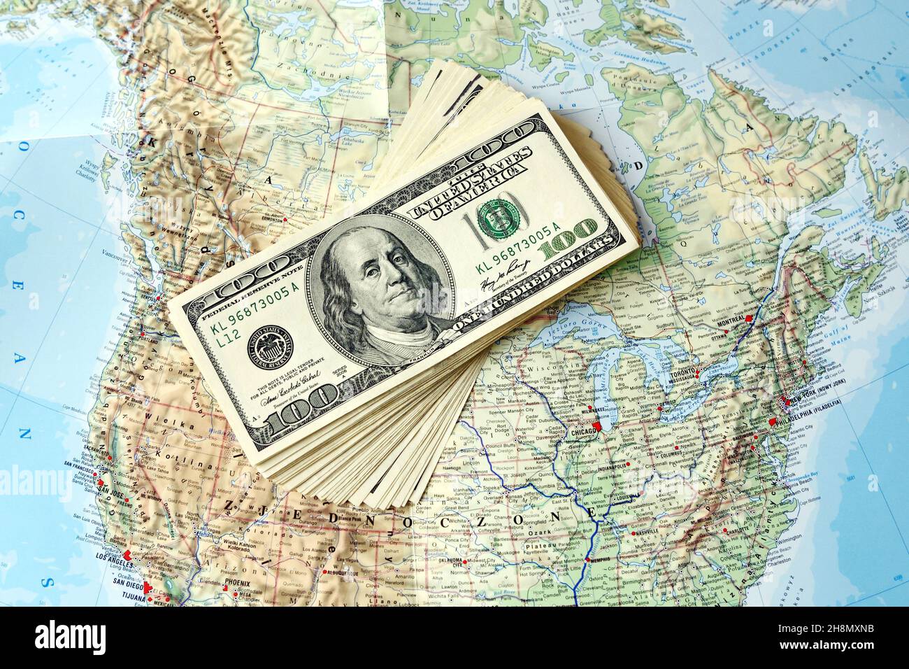 Map of North America and banknotes. American dollars with map as ...