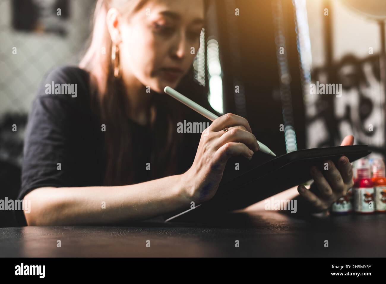 Portrait of professional female tattooist in tattoo studio Stock Photo ...