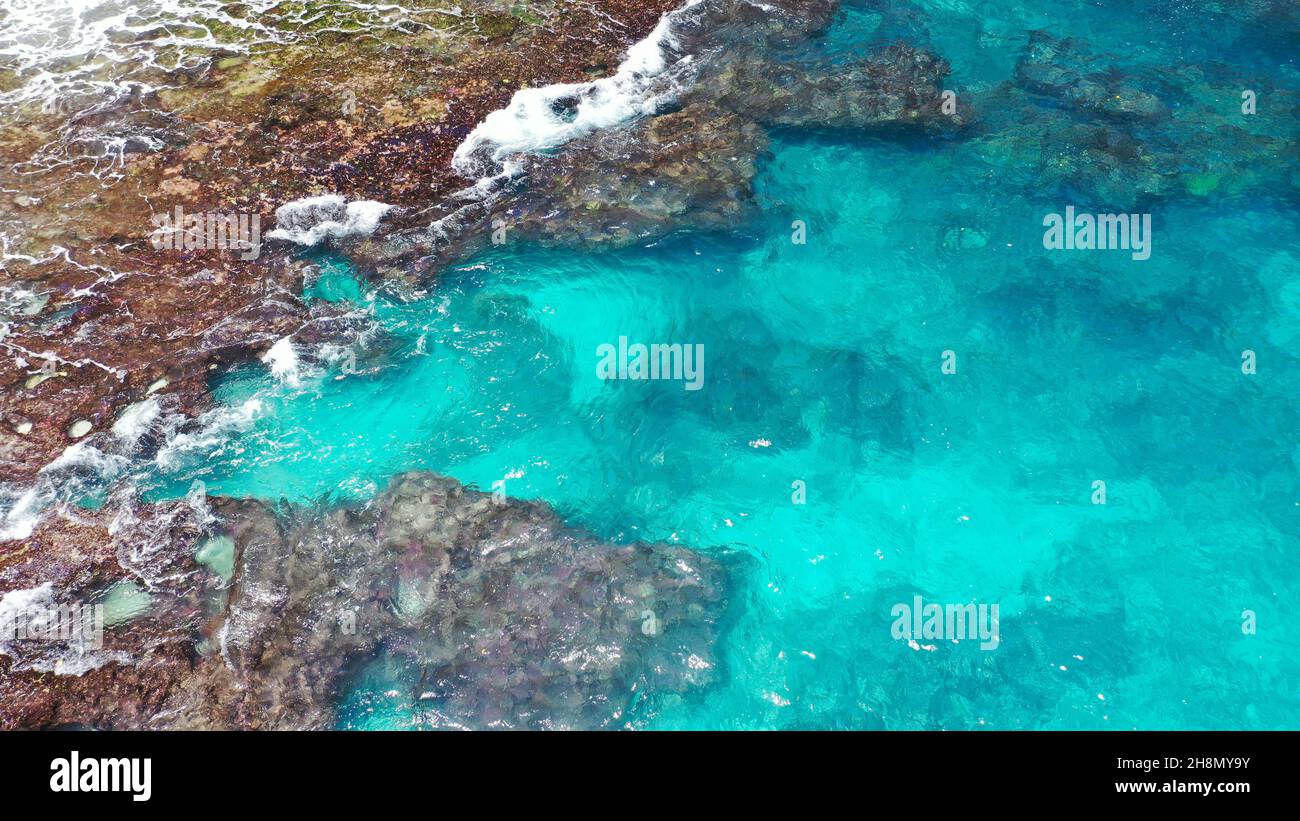 Aerial shot of the turquoise blue water in hole Broken Beach. Famous ...