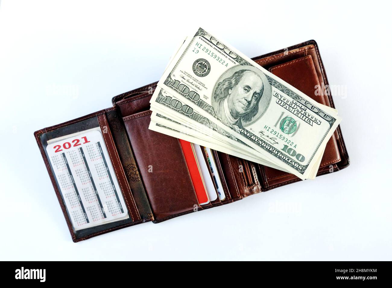 Illustrative photo: money and brown wallet. Cash, American dollars ...