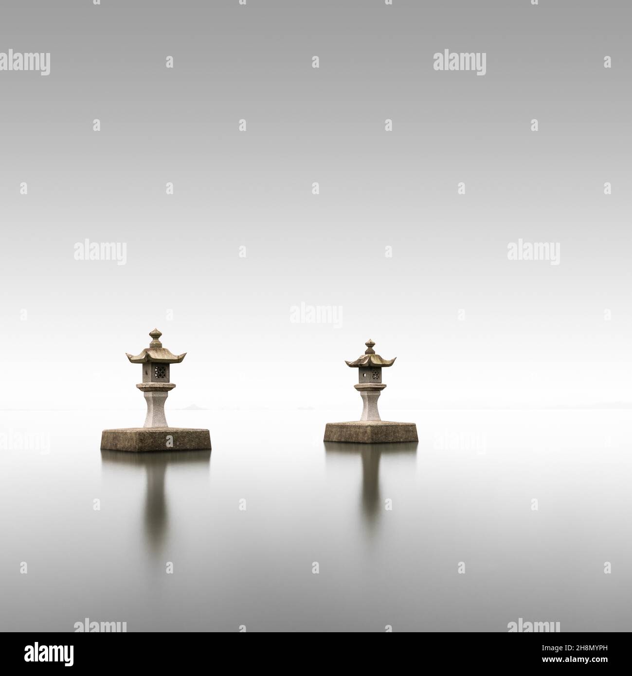 Traditional stone lamps on the coast of Japan Stock Photo - Alamy